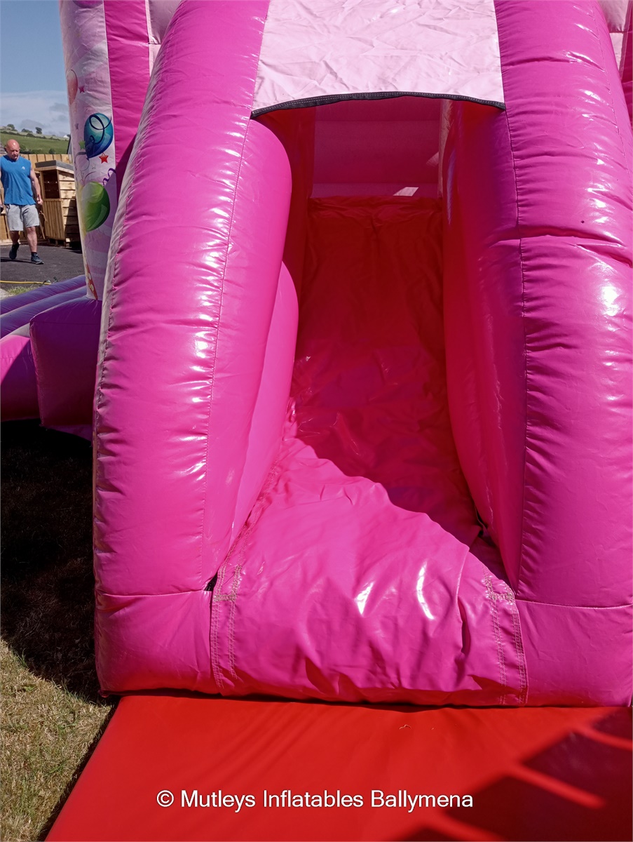 Pink Party Combi with side slide - Bouncy Castle Hire in Ballymena